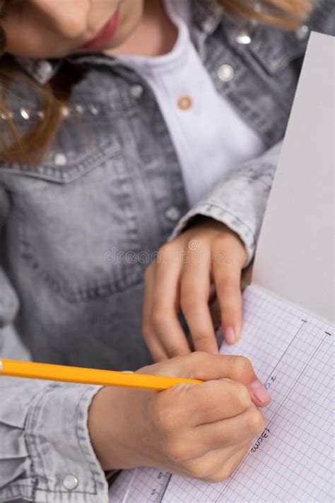 In The Maths Lesson The Student Draws With A Pencil And Using A Ruler To Solve The Tasks Stock