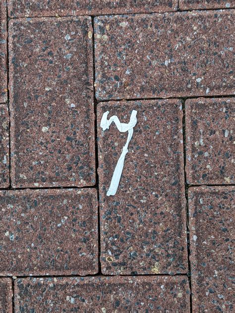 This Trampled On Straw Wrapper Looks Like A Fancy 7 R Pareidolia