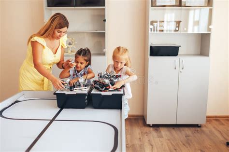 Two Babegirls Study In A Robotics Class Assemble A Robot Constructor Stock Photo Image Of