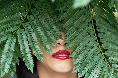 Sexy Portrait Of Woman With Tree Leaves On Top Of Her Face Photograph By Cavan Images Fine