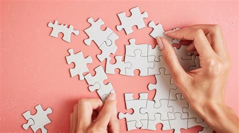 Hands Piecing Together Puzzle Sections Isolated Premium Ai Generated