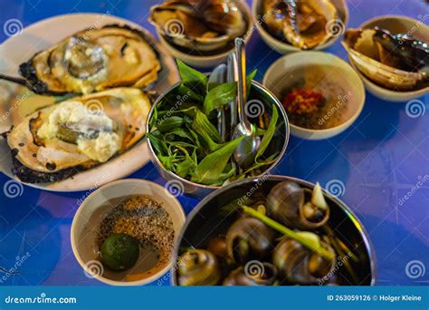 Street Food Dishes In The Streets Of Saigon Mussels Snails And
