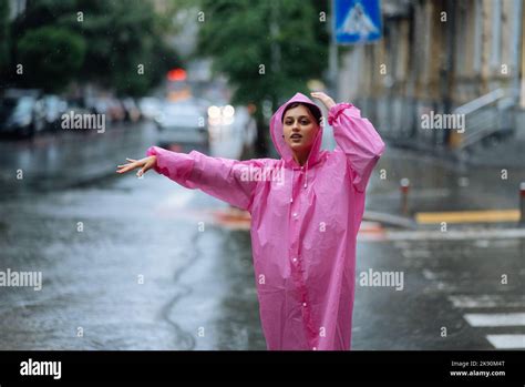 Young Girl Trying To Stop A Cab Woman Calling A Taxi On A Rainy Day