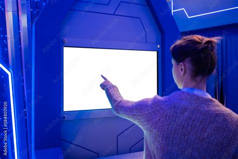 Woman Hand Using White Blank Interactive Touchscreen Display Of Electronic Multimedia Kiosk In