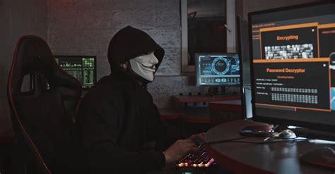 A Person Typing On Keyboard While Wearing A Hacker Mask Free Stock Video Footage Royalty Free