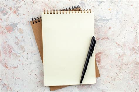 Premium Photo Top View Pen On Spiral Notebooks On Table