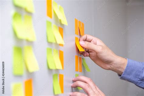IT Worker Tracking His Tasks On Kanban Board Using Task Control Of Agile Development