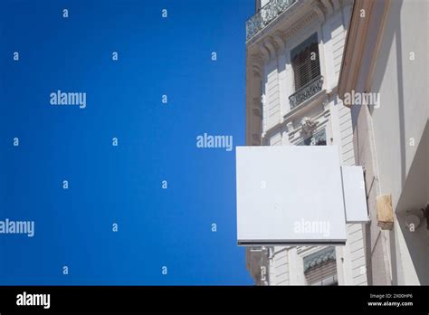 An Empty Vibrant White Square Signboard Prominently Displayed And