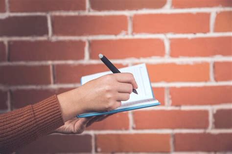 Premium Photo Woman Hand Pen And Notepad