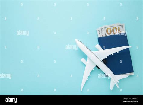Preparation For Traveling Concept Airplane Money Passport On Blue
