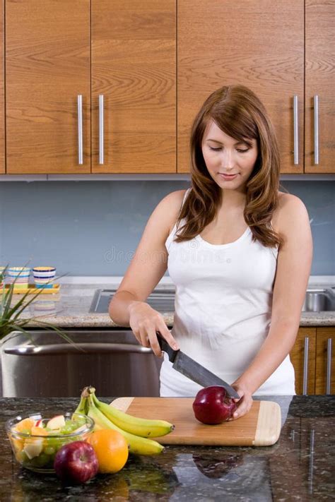 Woman Cutting An Apple Stock Photo Image Of Cheerful