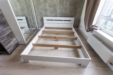 The Furniture Assembler Assembles The Bed Frame Do It Yourself And