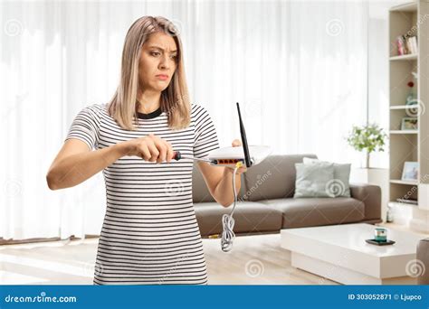 Angry Young Woman Fixing A Router Stock Image Image Of Device Screwdriver 303052871 Angry Young Woman Fixing A Router Stock Image Image Of Device Screwdriver 303052871