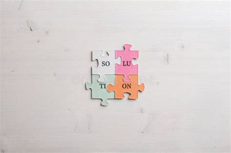 Word Solution Spelled With Syllables On Four Matching Colorful Puzzle