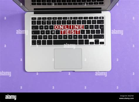 Online Test Laptop Keyboard With Buttons Making Words On Violet