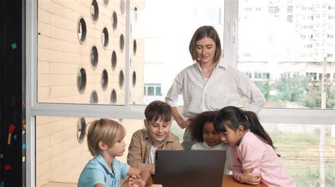 Cute Girl Programing System While Surround With Teacher And Friend