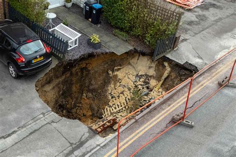 Giant 65 Foot Sinkhole Swallows Up Street