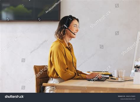 Female Tech Support Agent Answering Customer Stock Photo 2462125665