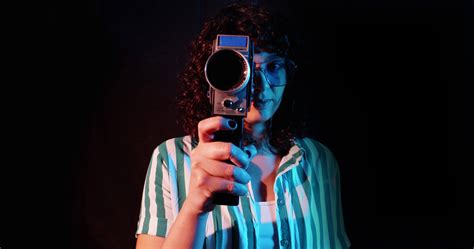 Young Woman With A Super 8 Camera Posing 22143618 Stock Video At Vecteezy Young Woman With A Super 8 Camera Posing 22143618 Stock Video At Vecteezy