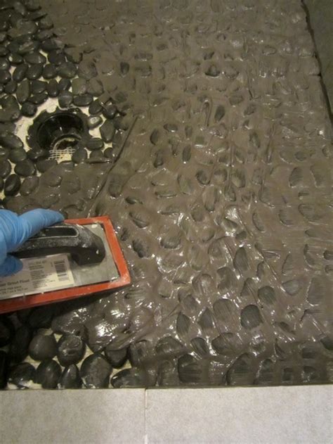 How To Grout Pebble Tile Decor Adventures Pebble Tile Pebble Shower Floor Tile Floor Diy