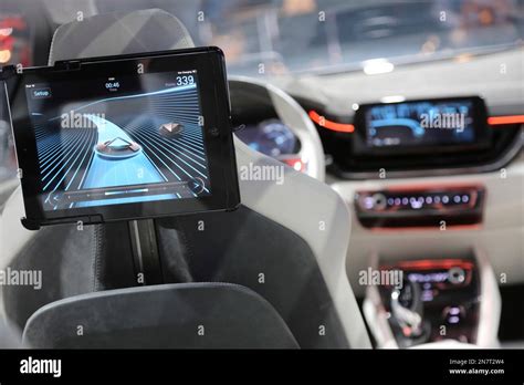 An Ipod Is Attached To The Back Of The Drivers Seat In The Bmw Concept Active Tourer Bing
