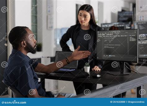 Diverse Team Of Software Developer Developing Html Code And Cloud