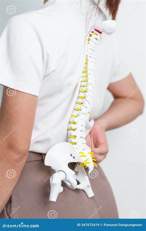 Lumbar And Cervical Spine Hernia Man With Back Pain At Home