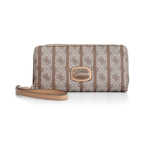 Lyst Guess Wallet Jasleen Large Zip Around With Wristlet Strap In Brown