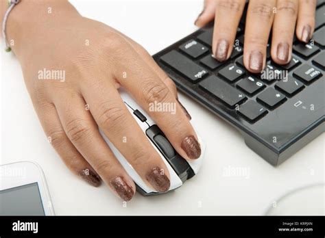 Woman Using Computer Mouse And Keyboard Stock Photo Alamy