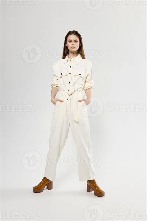Woman Spread Her Legs And White Jumpsuits Fashion Clothing Style Stock Photo At Vecteezy