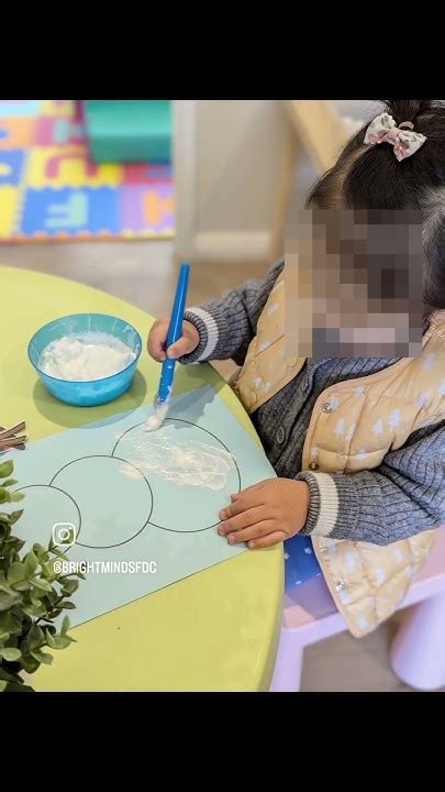Creating Snowman Crafts With Puffy Glue And Paper Cut Outs Helped