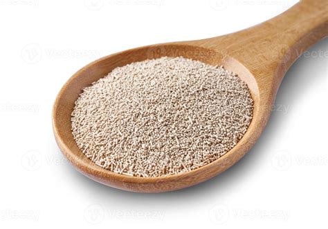 Instant Dry Yeast In Wooden Spoon Isolated On White Background With