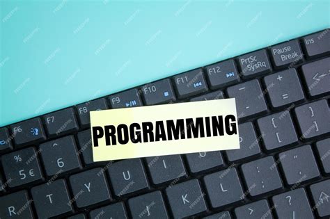 Premium Photo Laptop Keyboard And Colored Paper With The Word Programming