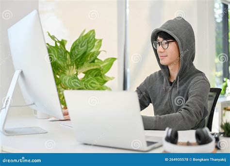 Nerd Young Asian Male Website Developer Or Programmer Focusing On His