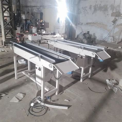 Cnc Machine Conveyor System 100 Kg Feet Cnc Machine Conveyor System Manufacturer From Gondal
