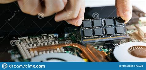 Ram Module In The Motherboard Of A Computer Laptop Holding In Hand