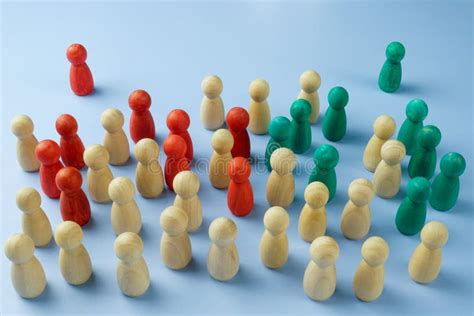 Wooden Figures And Two As Opinion Leaders Or Influencers Stock Image