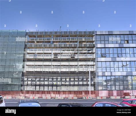 renovation of industrial building facade with scaffolding and safety