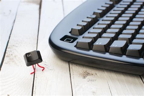 premium photo escape key run away from a black keyboard concept photo