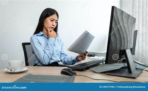 Female Programmer Reading Document Of Database Code To Thinking For Website Development While