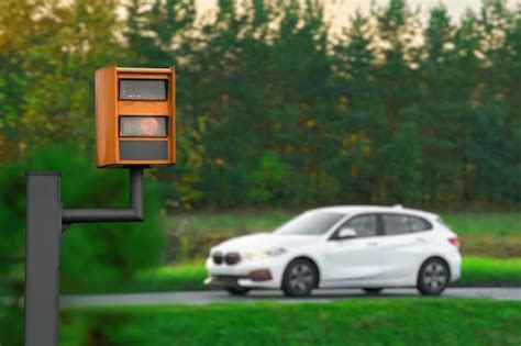 Premium Photo A Yellow Speed Camera Flashes As It Detects A Speeding