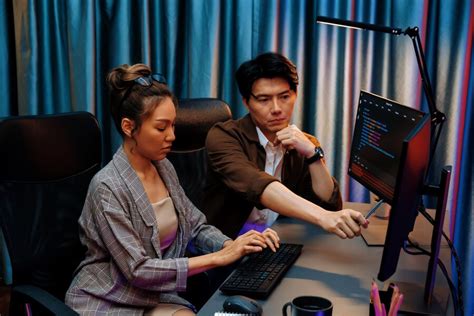 Premium Photo It Developers Discussing With Point Website Coding System Infobahn