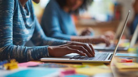 Person Is Typing On A Laptop With Lines Of Code Visible On The Screen