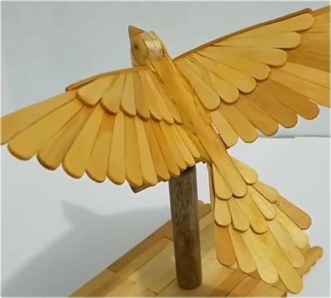Man Uses Glue And Popsicle Sticks To Make Beautiful Flying Bird Ornaments
