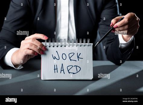 Sign Displaying Work Hard Word Written On Laboring That Puts Effort