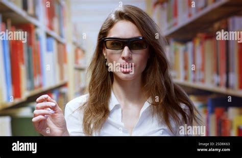 Portrait Of Beautiful Young Woman Librarian Working With Smart Glasses