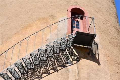 Premium Photo The Side Of A Tower To Small Mansion