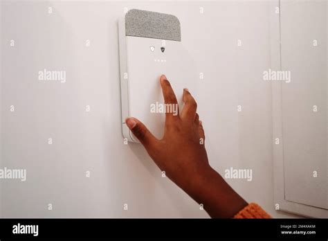 Hand Of Girl Putting Code In Alarm System At Home Stock Photo Alamy