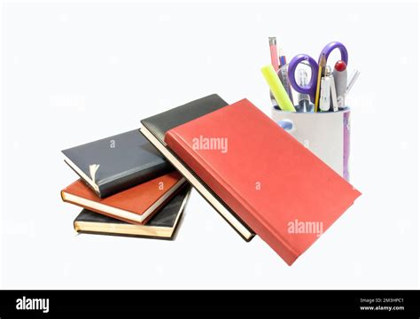 A Stationery Colored Notebooks With Pencils And Pens Holder Isolated On White Background Stock