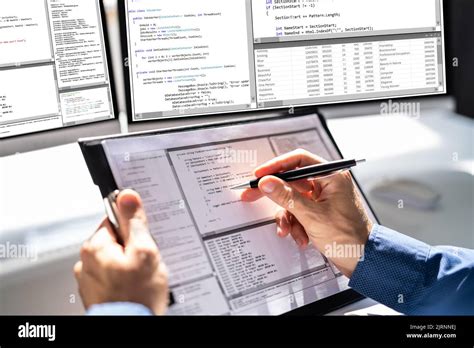 web developer looking at code computer database software programming